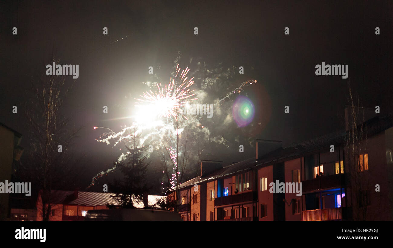 fireworks in the night sky over houses Stock Photo - Alamy