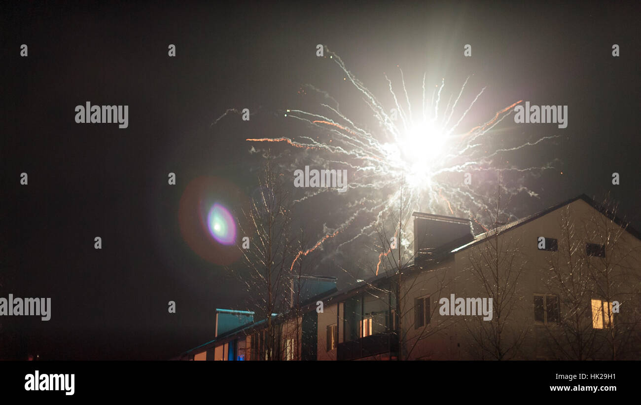fireworks in the night sky over houses Stock Photo - Alamy