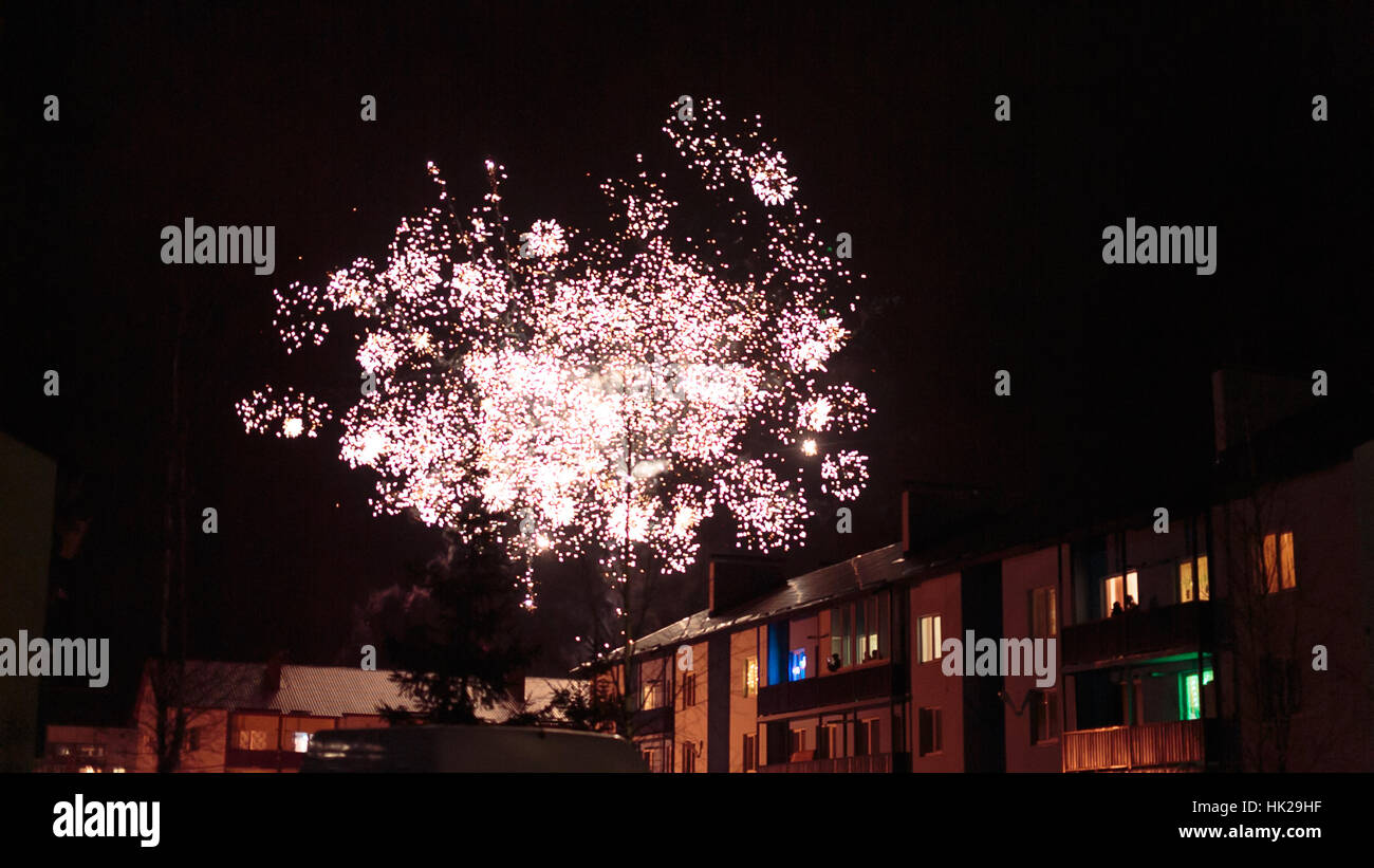 fireworks in the night sky over houses Stock Photo - Alamy