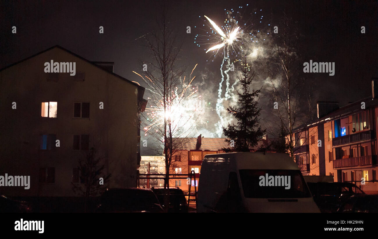 fireworks in the night sky over houses Stock Photo - Alamy