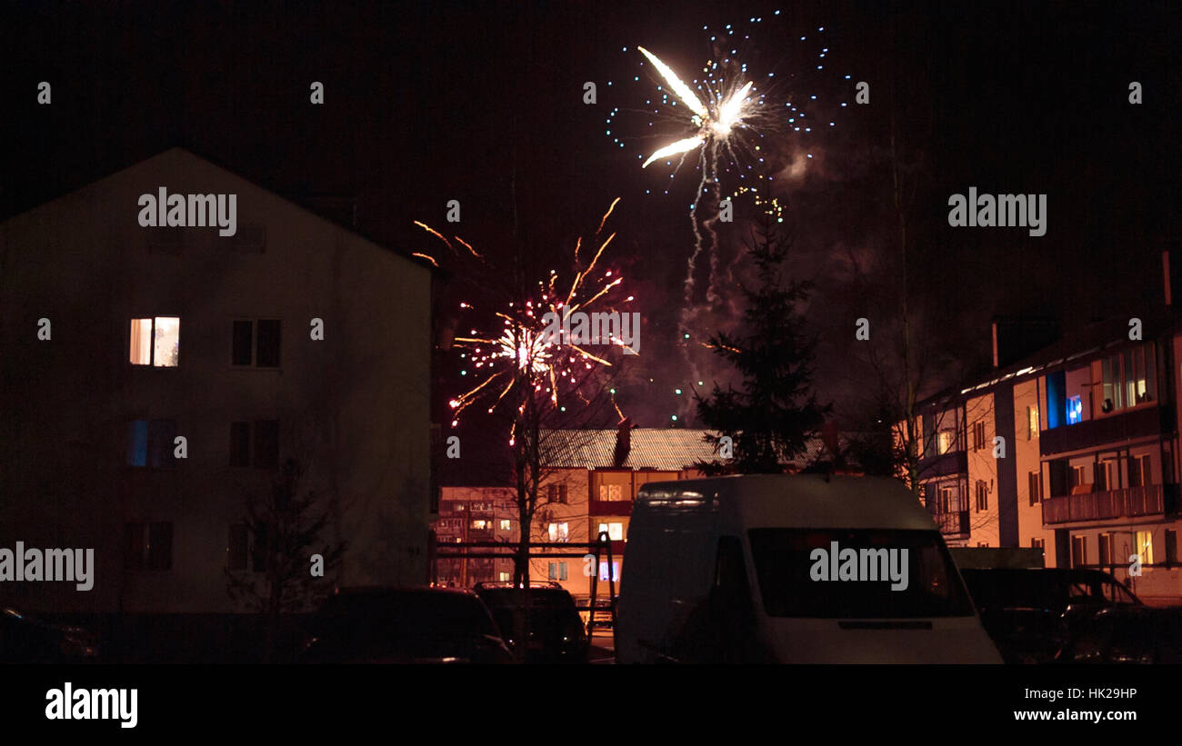 fireworks in the night sky over houses Stock Photo - Alamy