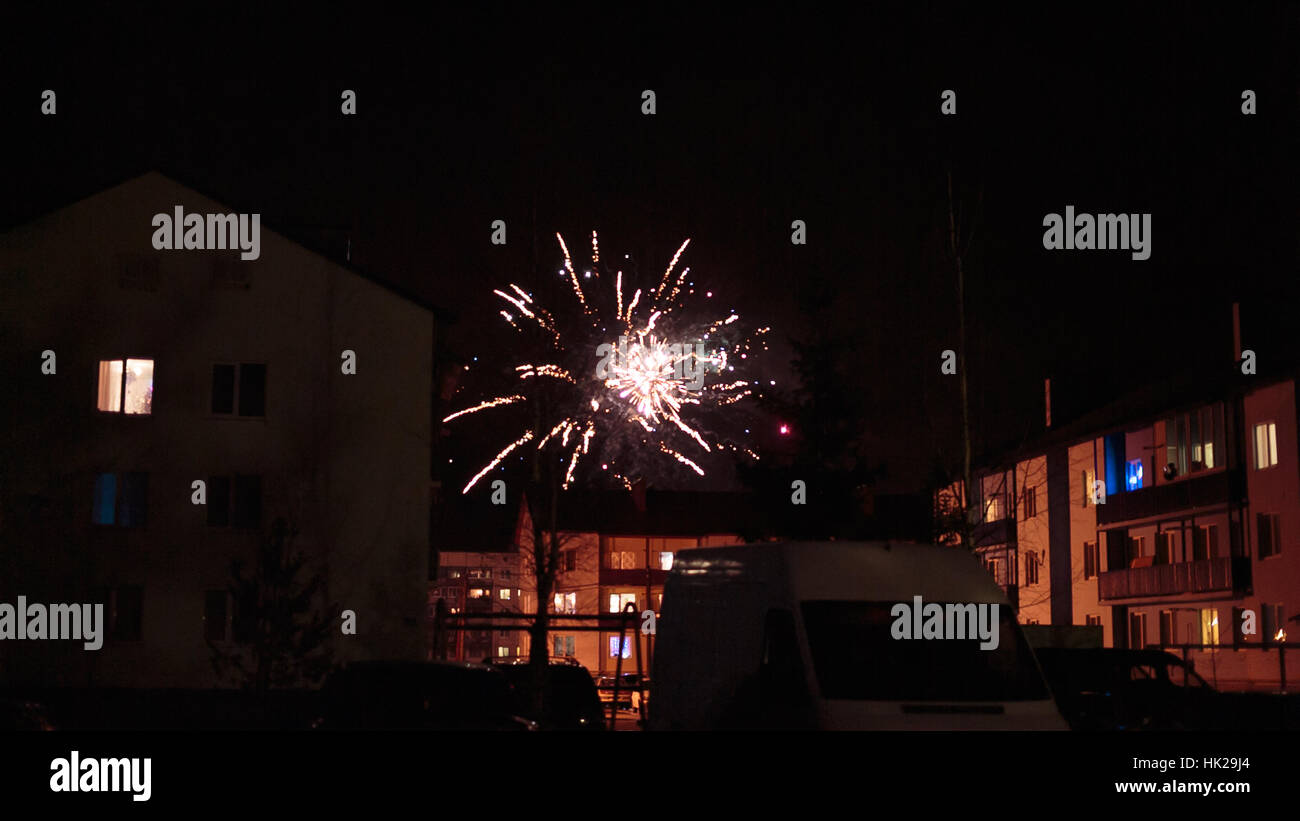 fireworks in the night sky over houses Stock Photo - Alamy