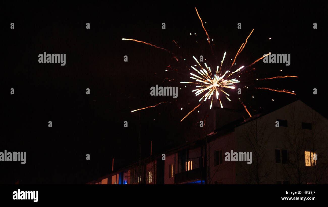 fireworks in the night sky over houses Stock Photo - Alamy