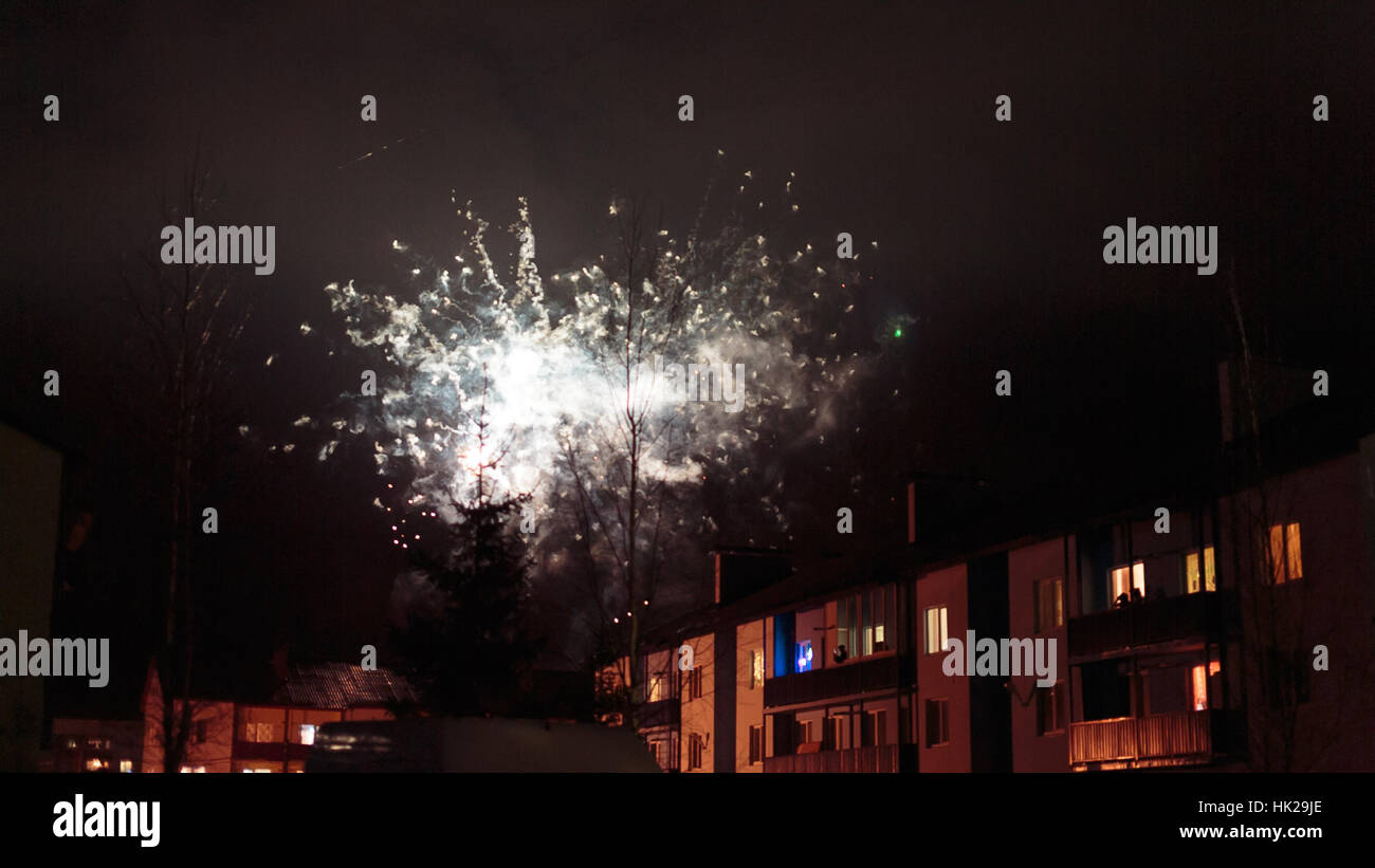fireworks in the night sky over houses Stock Photo - Alamy