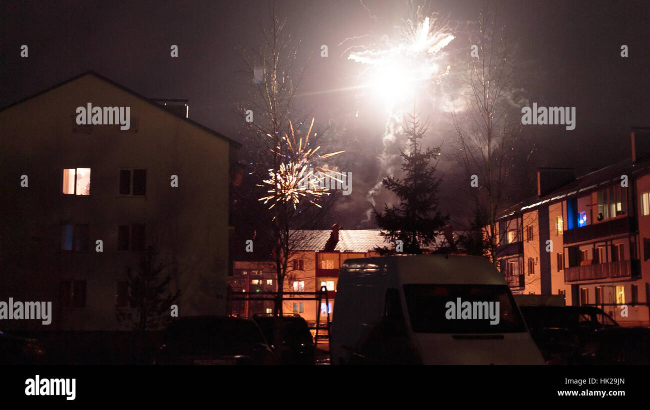 fireworks in the night sky over houses Stock Photo - Alamy