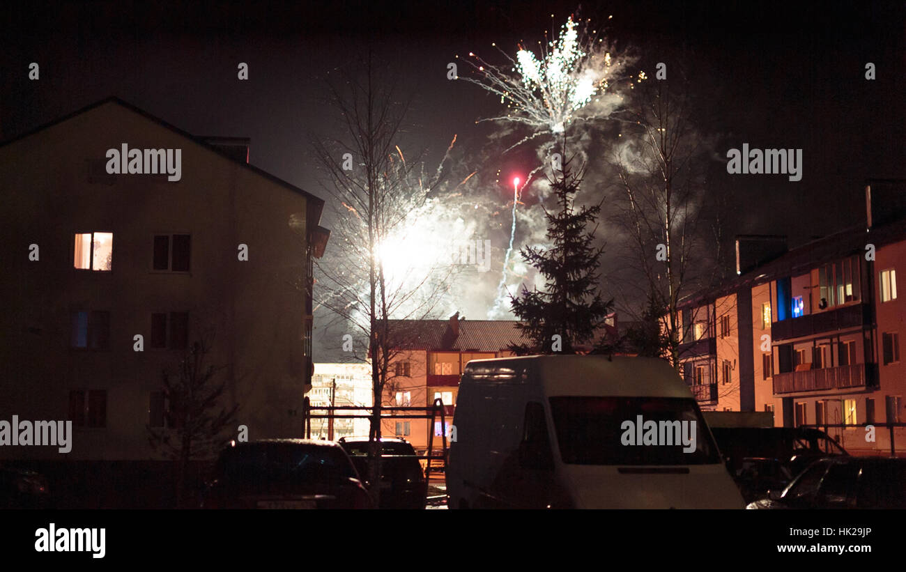 fireworks in the night sky over houses Stock Photo - Alamy
