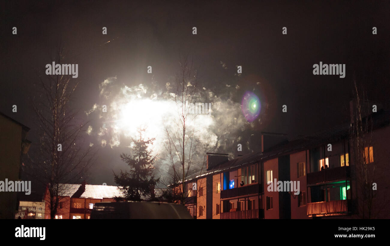 fireworks in the night sky over houses Stock Photo - Alamy