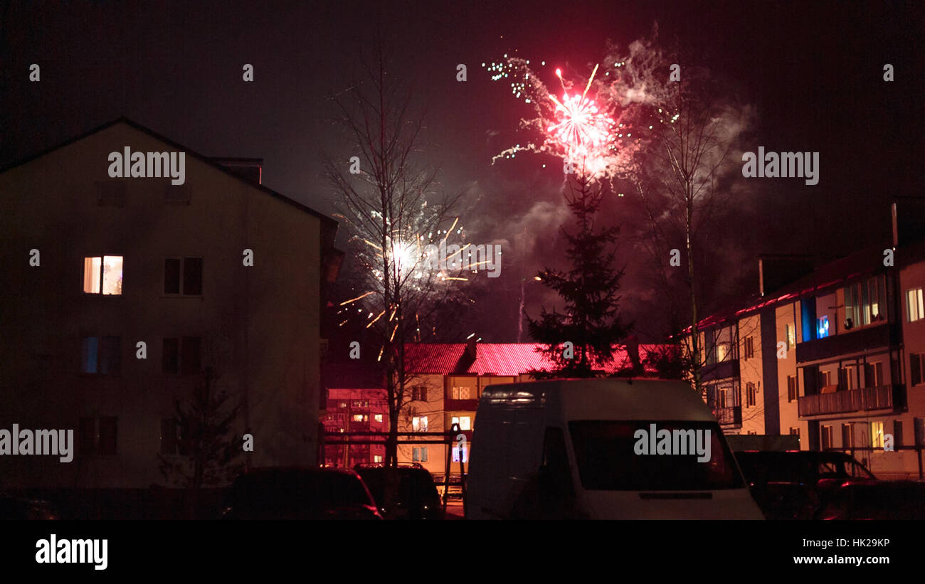 fireworks in the night sky over houses Stock Photo - Alamy