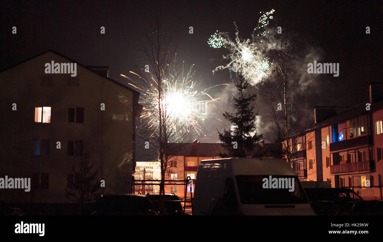 fireworks in the night sky over houses Stock Photo - Alamy