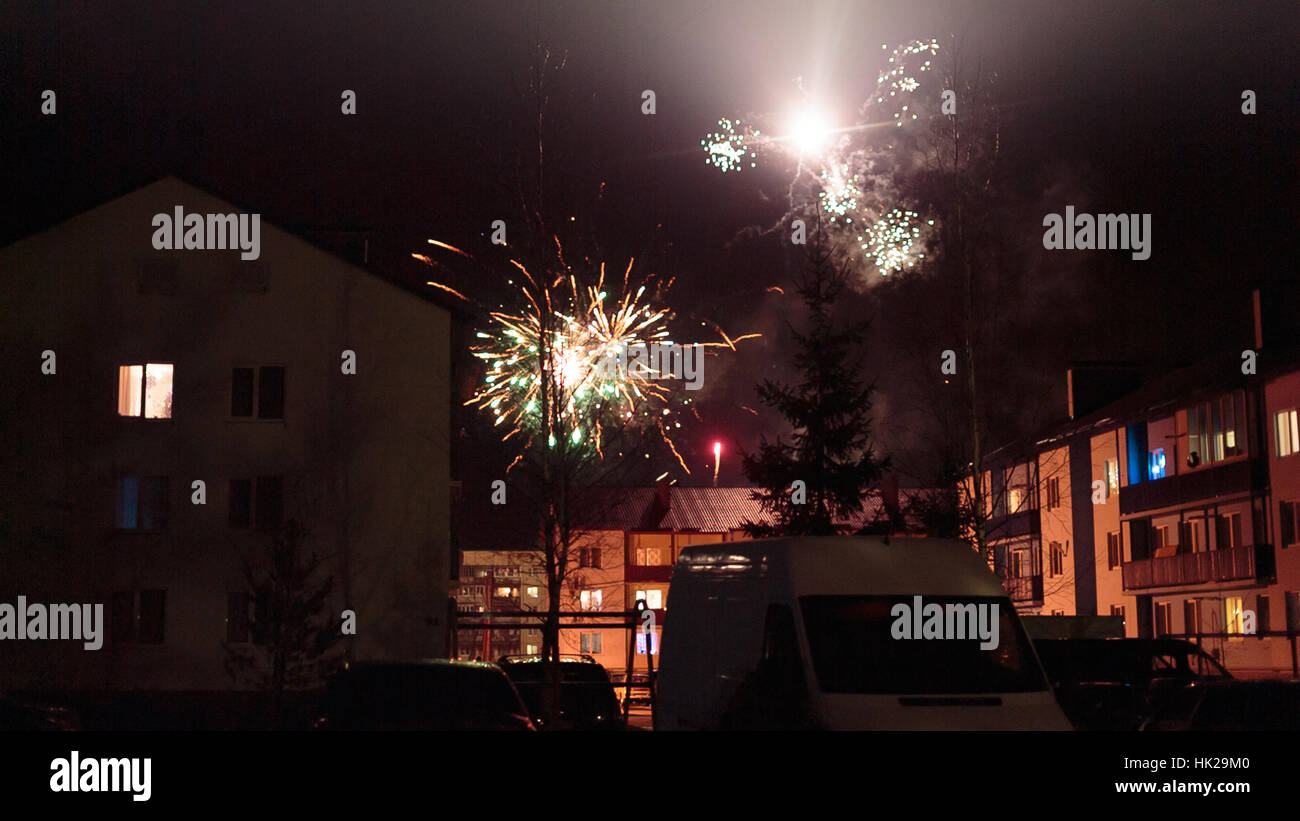 fireworks in the night sky over houses Stock Photo - Alamy
