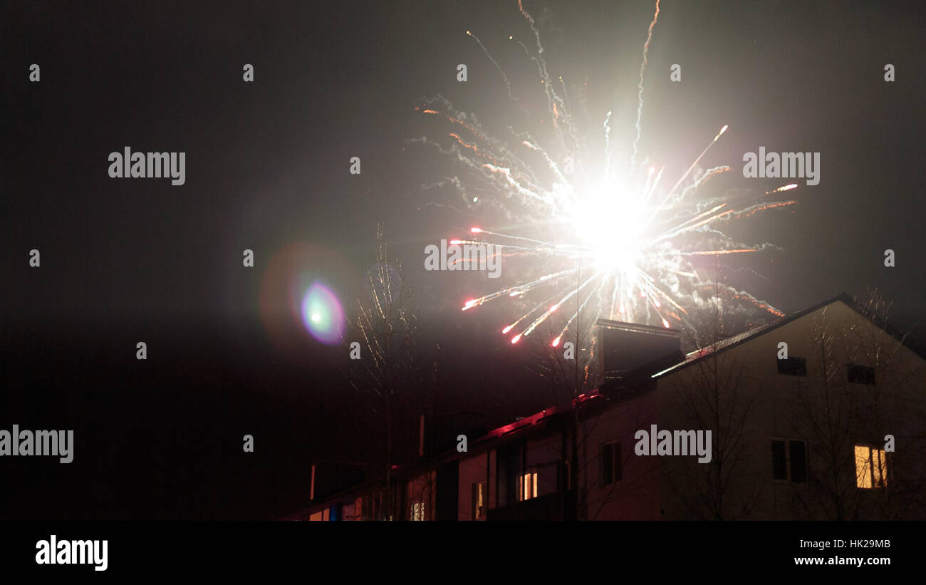 fireworks in the night sky over houses Stock Photo - Alamy