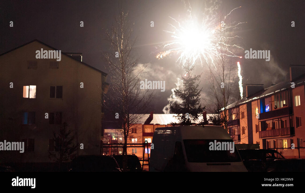 fireworks in the night sky over houses Stock Photo - Alamy
