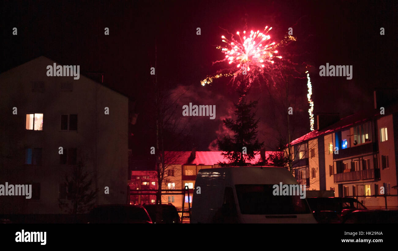 fireworks in the night sky over houses Stock Photo - Alamy