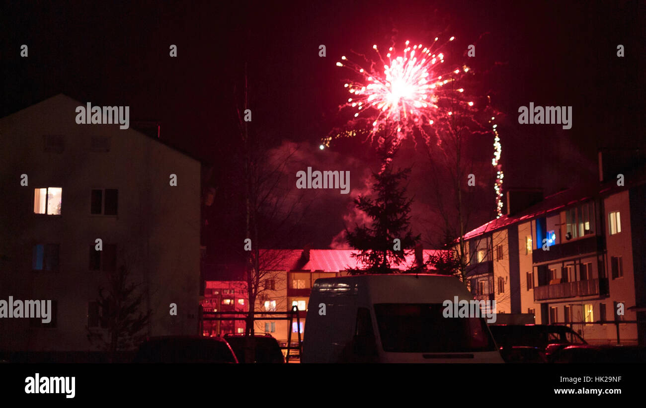 fireworks in the night sky over houses Stock Photo - Alamy