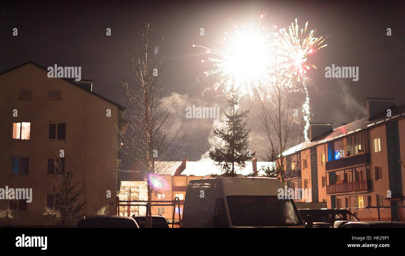 fireworks in the night sky over houses Stock Photo - Alamy