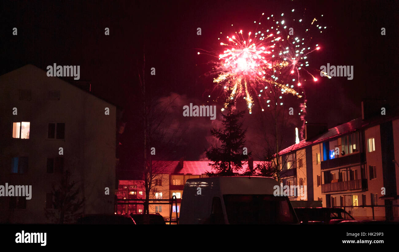 fireworks in the night sky over houses Stock Photo - Alamy
