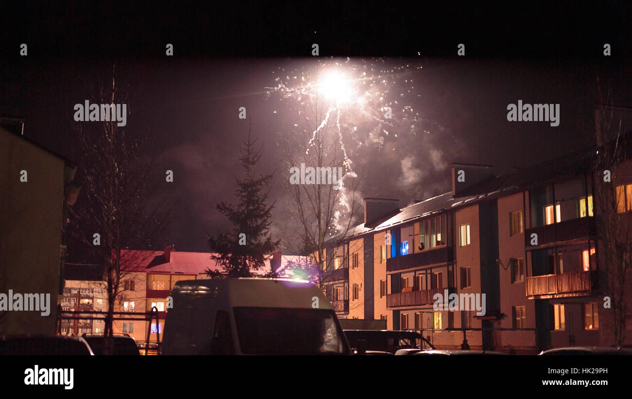 fireworks in the night sky over houses Stock Photo - Alamy
