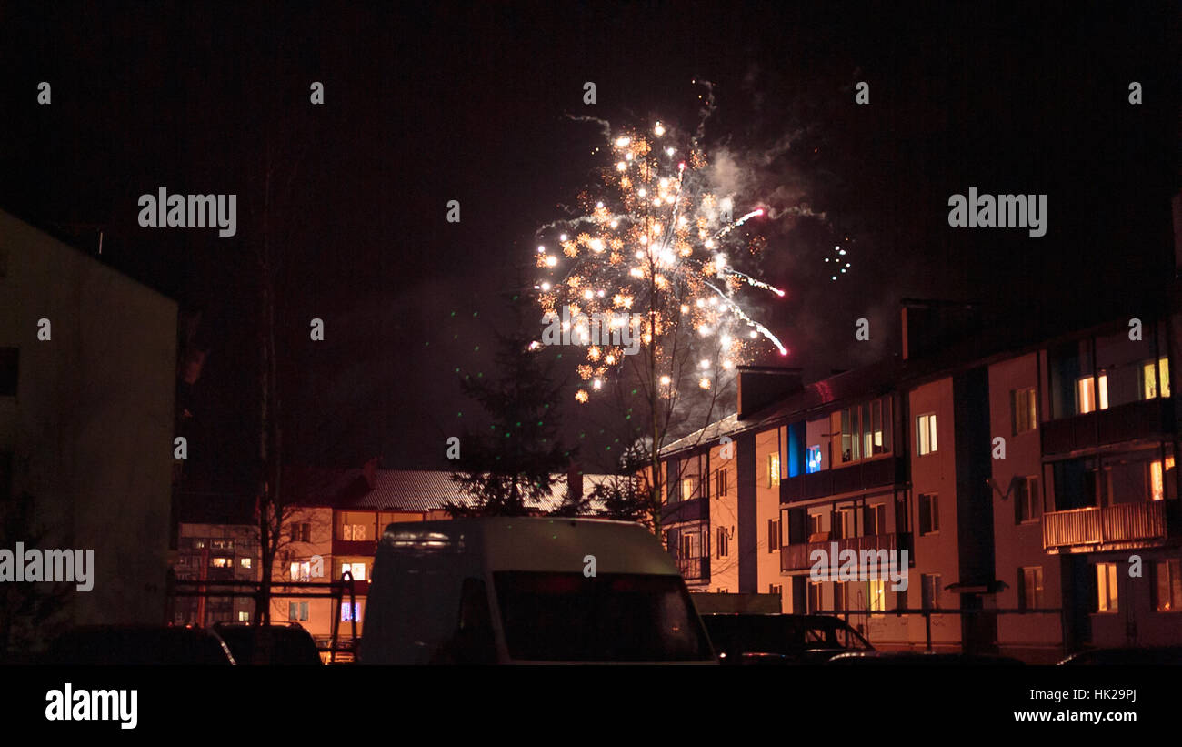 fireworks in the night sky over houses Stock Photo - Alamy