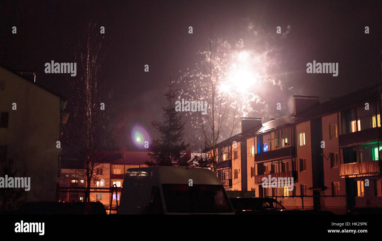 fireworks in the night sky over houses Stock Photo - Alamy