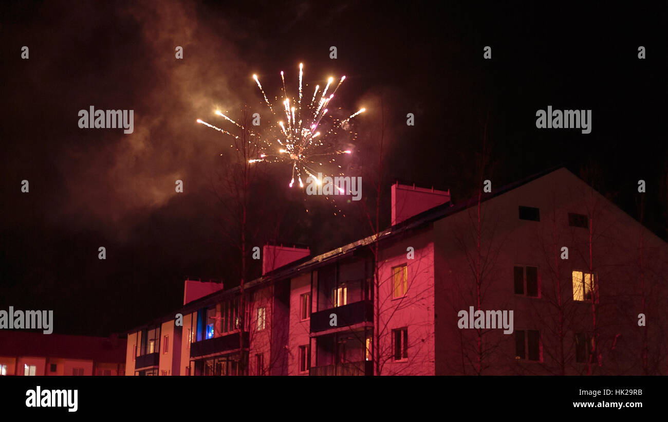 fireworks in the night sky over houses Stock Photo - Alamy