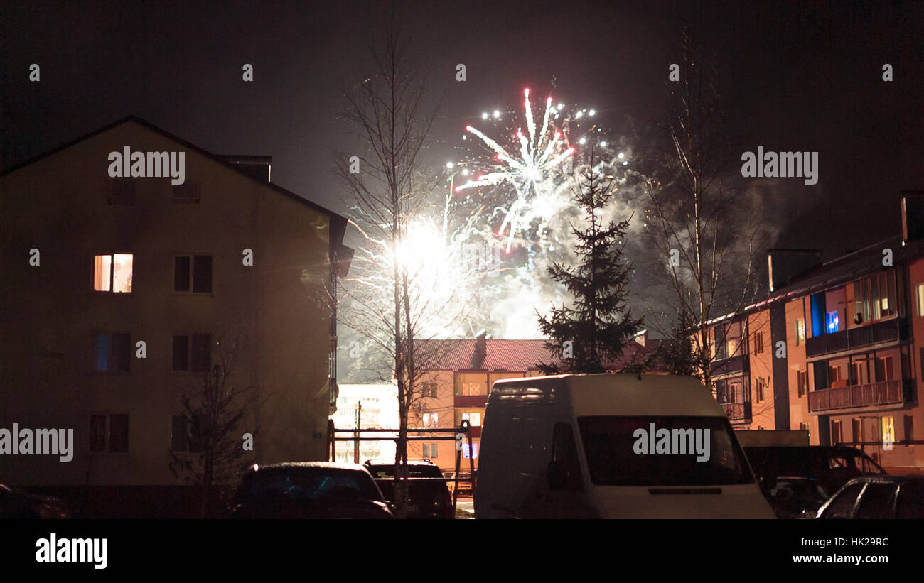fireworks in the night sky over houses Stock Photo - Alamy