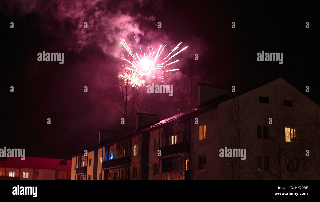 fireworks in the night sky over houses Stock Photo - Alamy