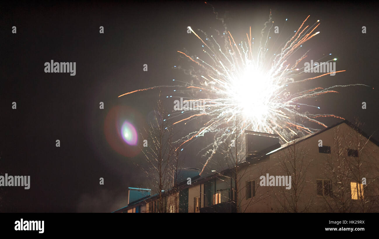 fireworks in the night sky over houses Stock Photo - Alamy