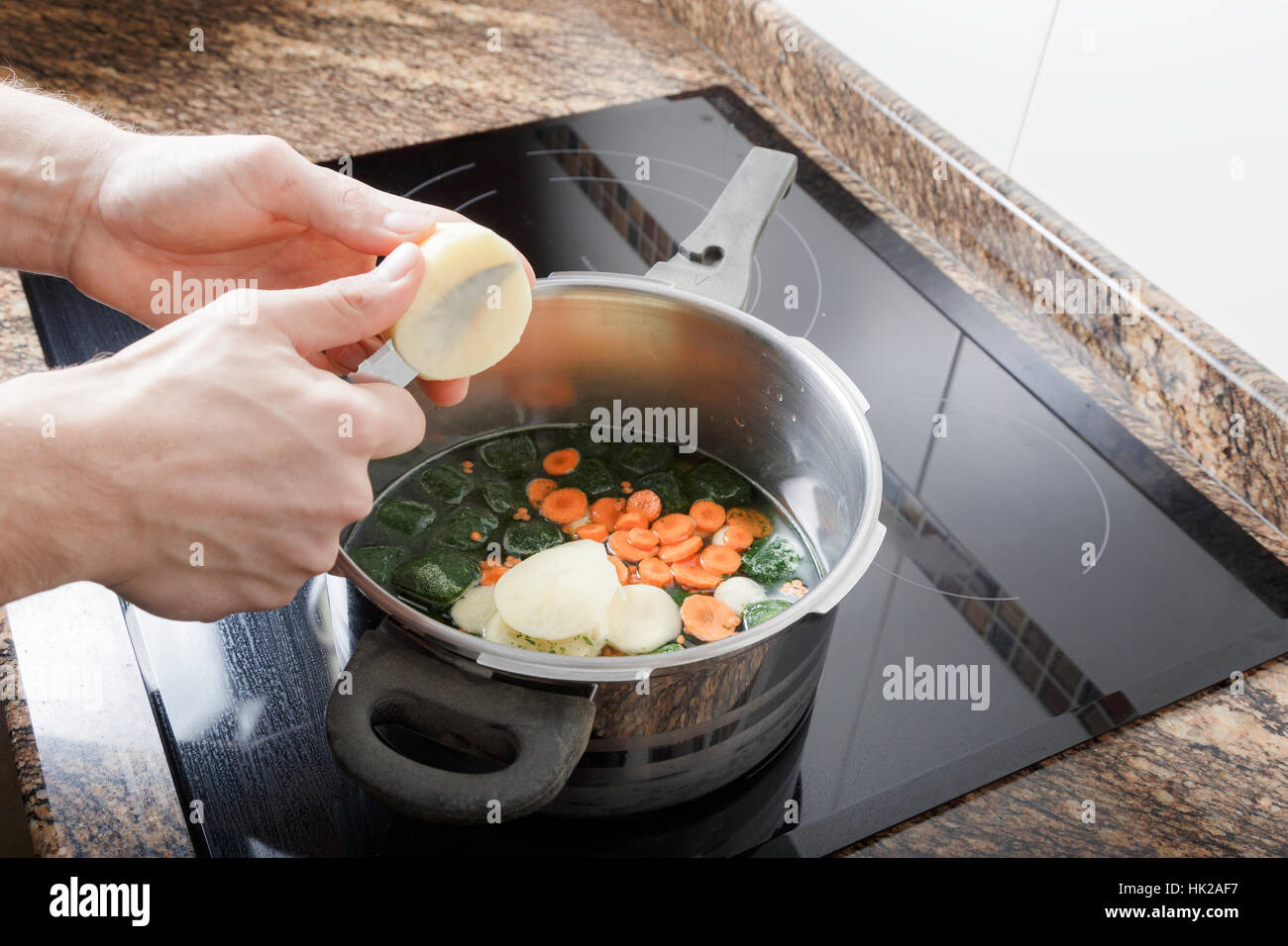 Closeup man cooking soup hand hi-res stock photography and images - Alamy
