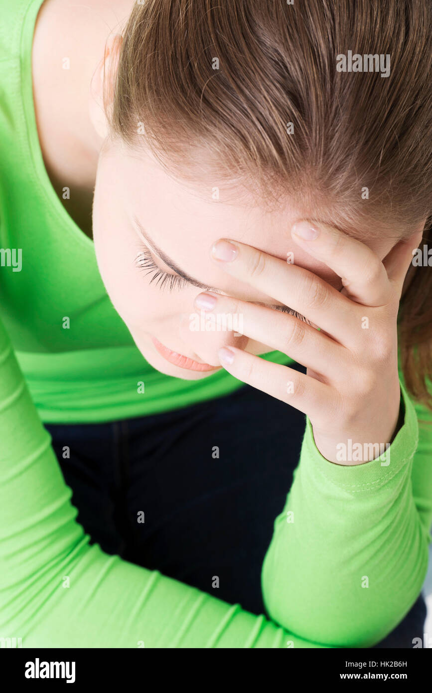 Young sad woman, have big problem or depression, over white background ...