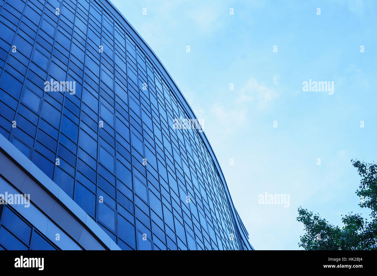 multi-story glass office building against the sky Stock Photo - Alamy