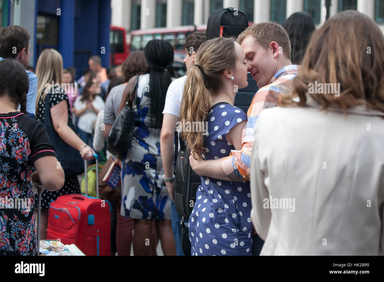 LONDON, ENGLAND - JULY 12, 2016 Young loving couple embracing and ...