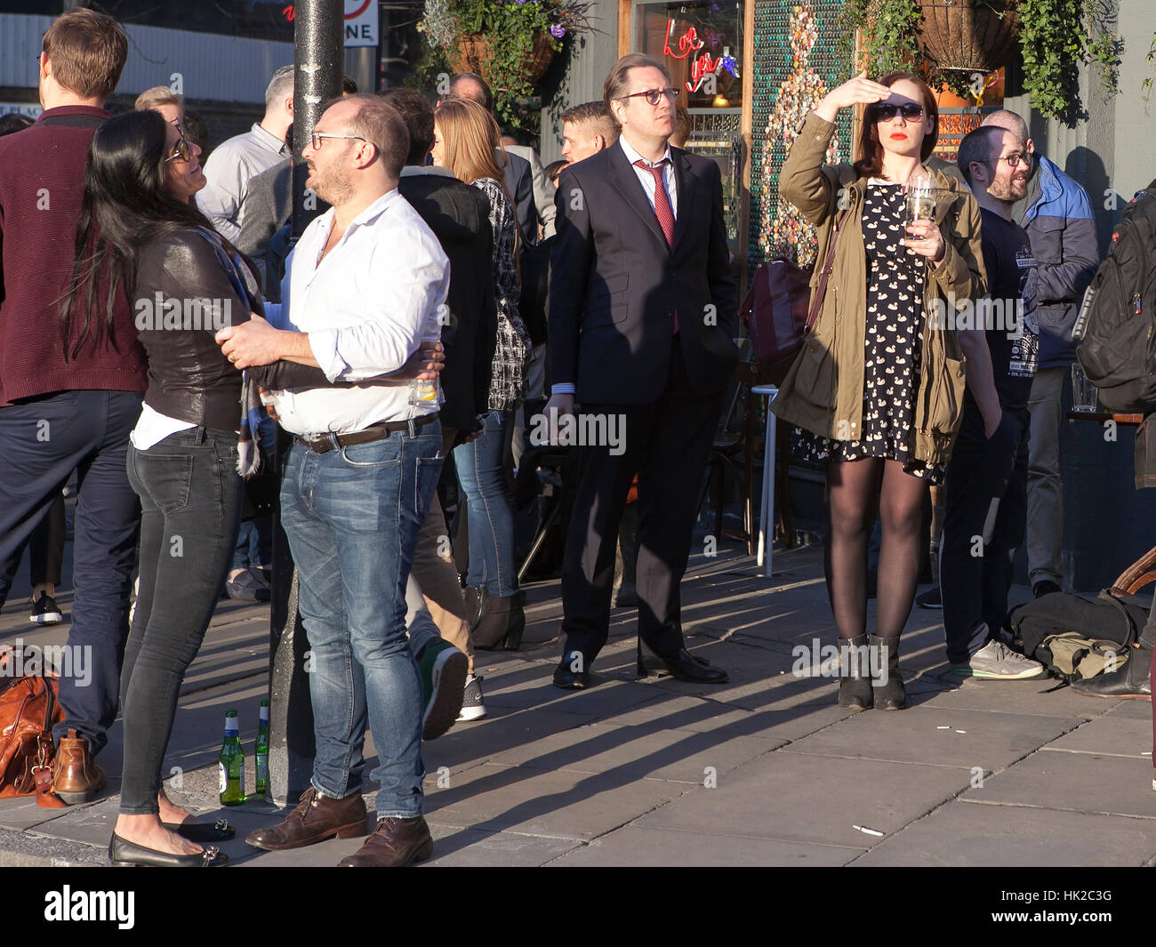 LONDON, ENGLAND - JULY 12, 2016 A crowd of young people talking to each ...