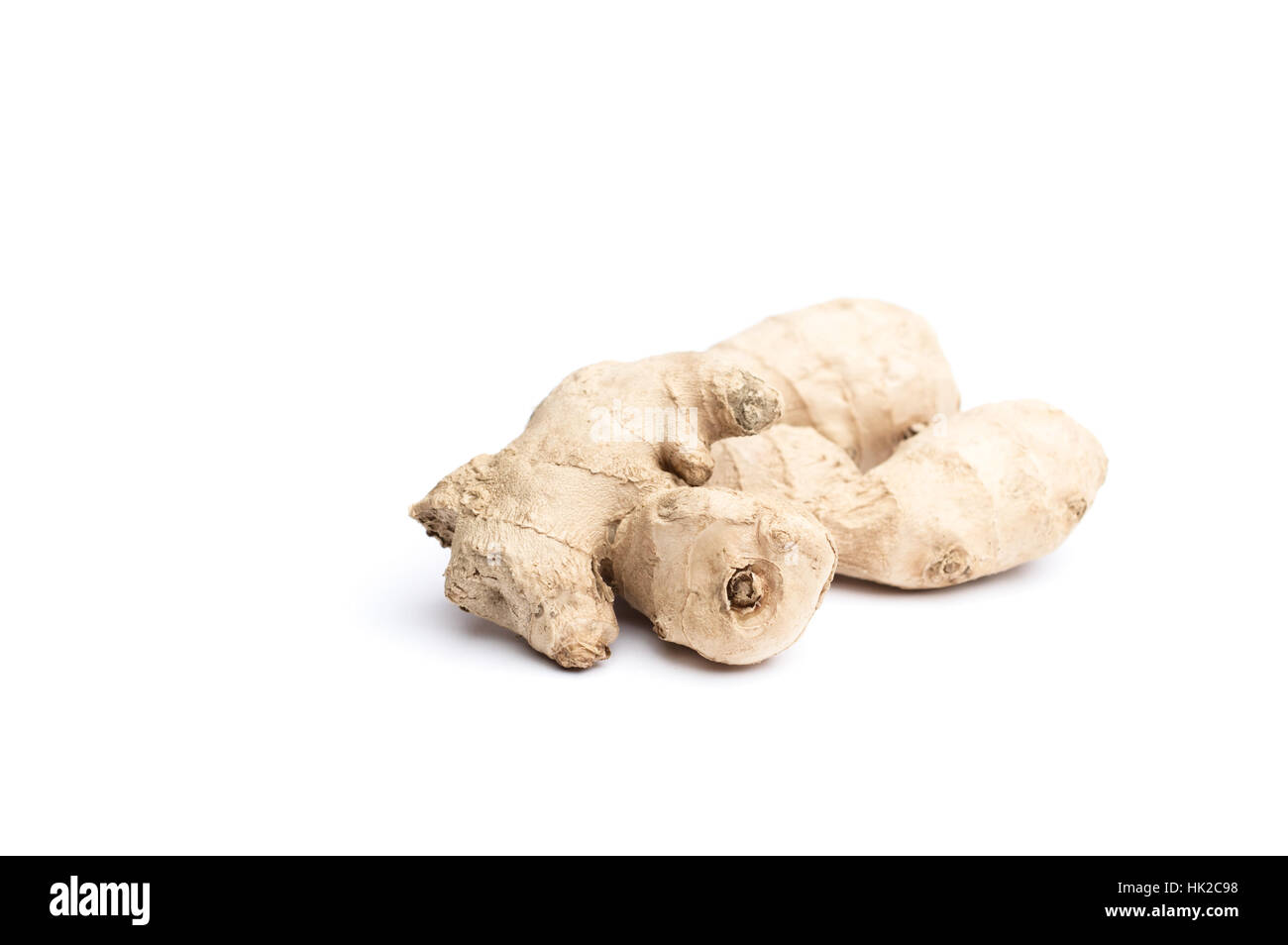 Uncut spice ginger root isolated against white background selective ...