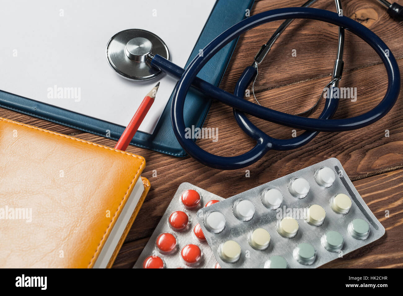 Desk of doctor with medicine things Stock Photo - Alamy