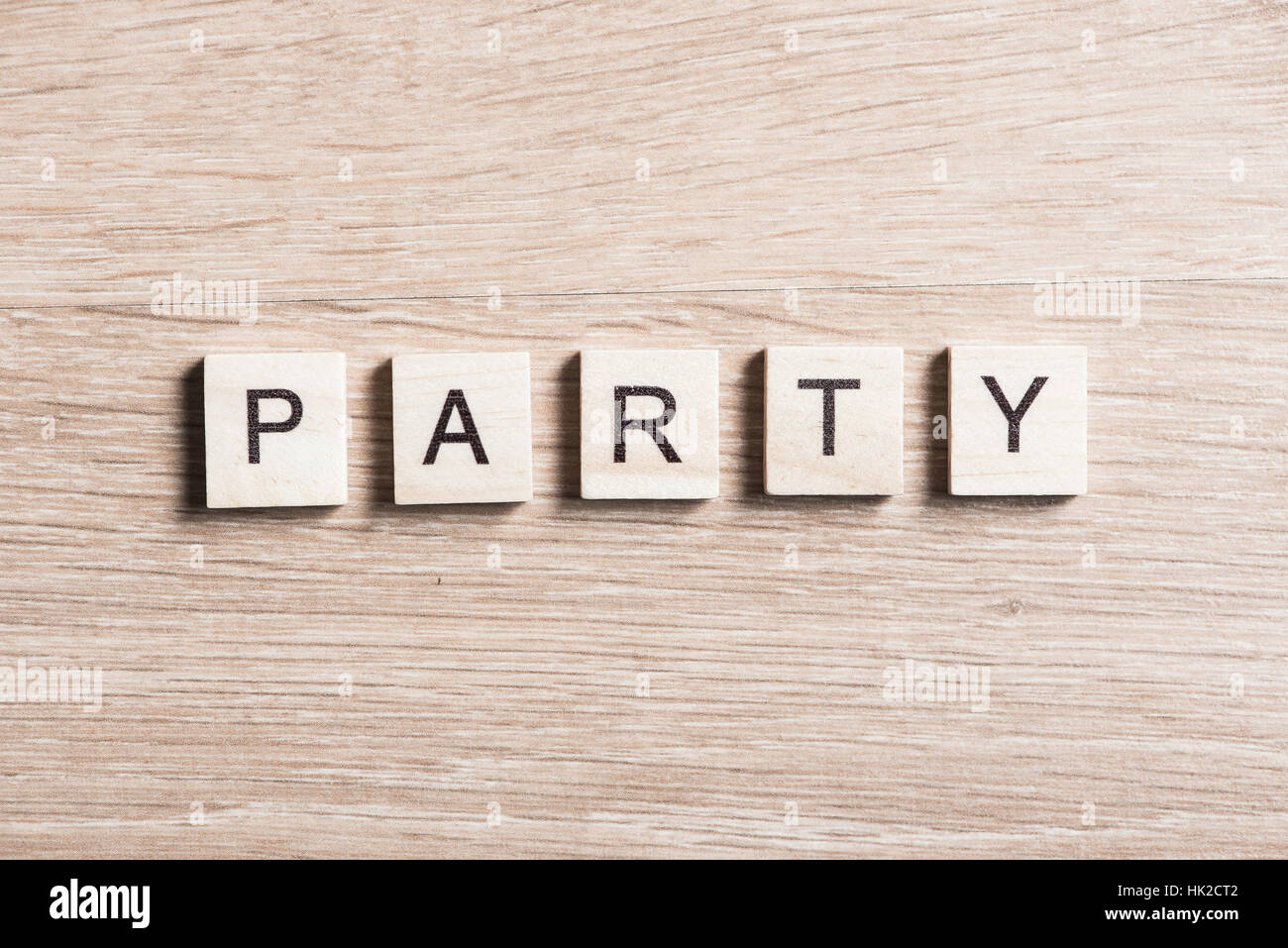 wooden elements with letter collected to word party Stock Photo - Alamy