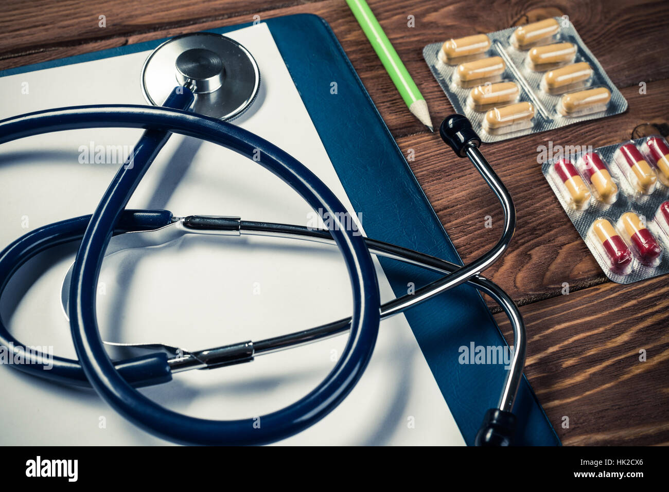 Desk of doctor with medicine things Stock Photo - Alamy
