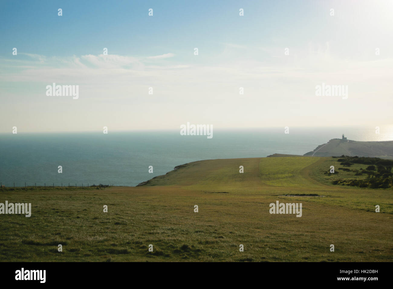 Distant lighthouse on top of a cliff Stock Photo - Alamy