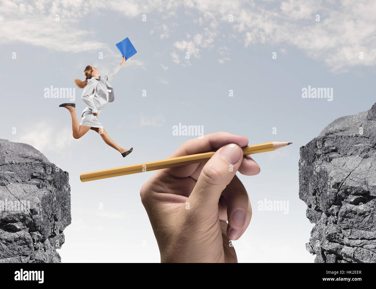 Businesswoman jumping over gap. Risk and challenge concept Stock Photo ...