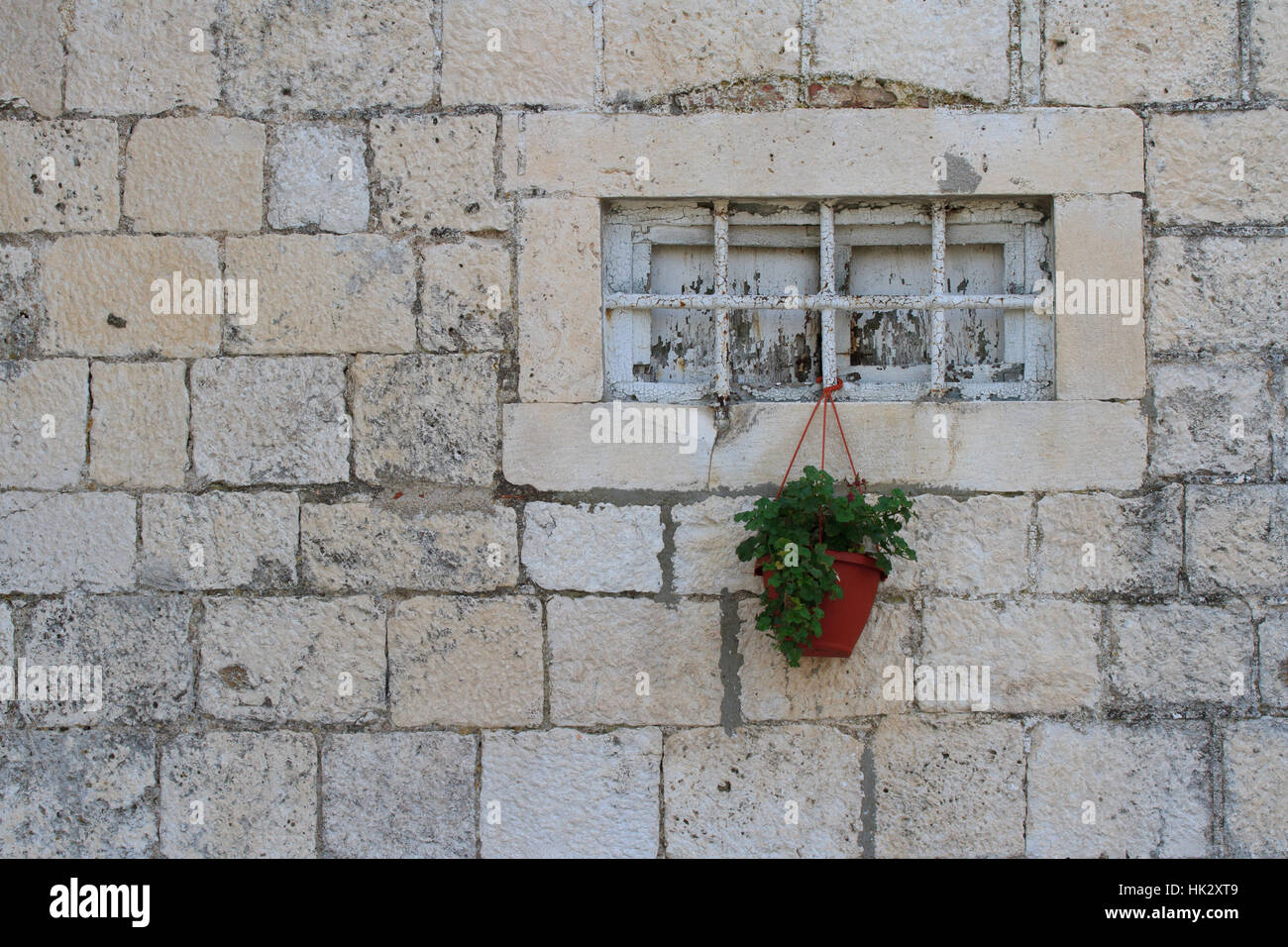 old small window with bars and potted plant. horizontal Stock Photo - Alamy