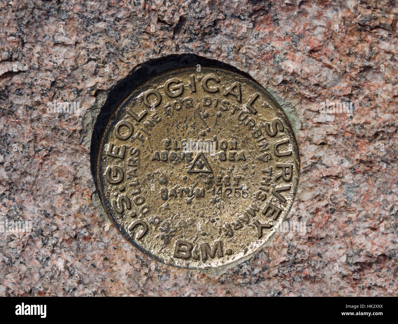 Benchmark on the 14255 foot summit of Longs Peak in Rocky Mountain ...