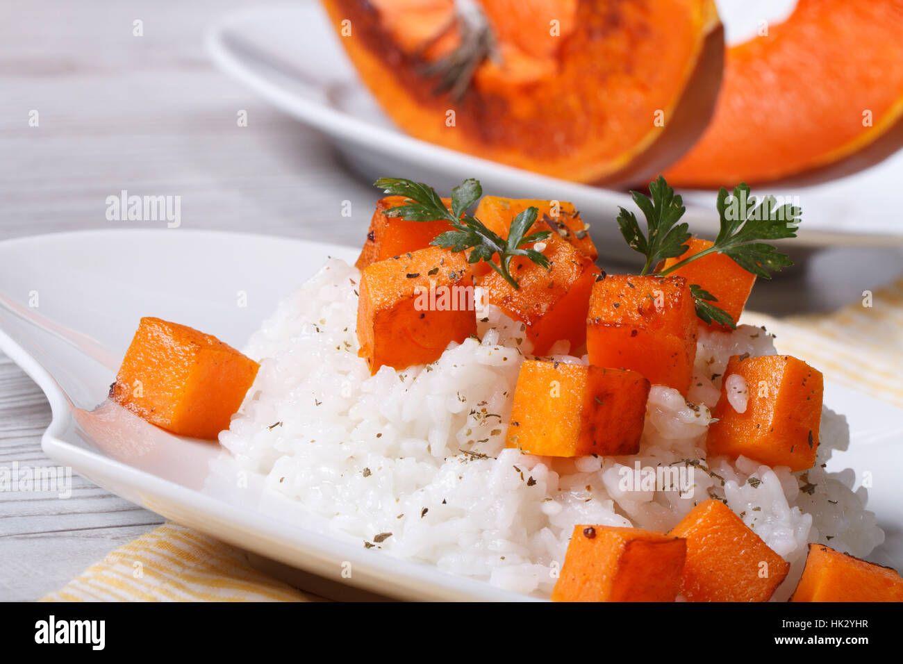 Rice with roasted pumpkin close-up on a plate. horizontal Stock Photo ...