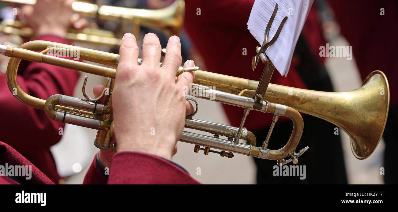 trumpeter plays his trumpet in the brass band during live concert with ...