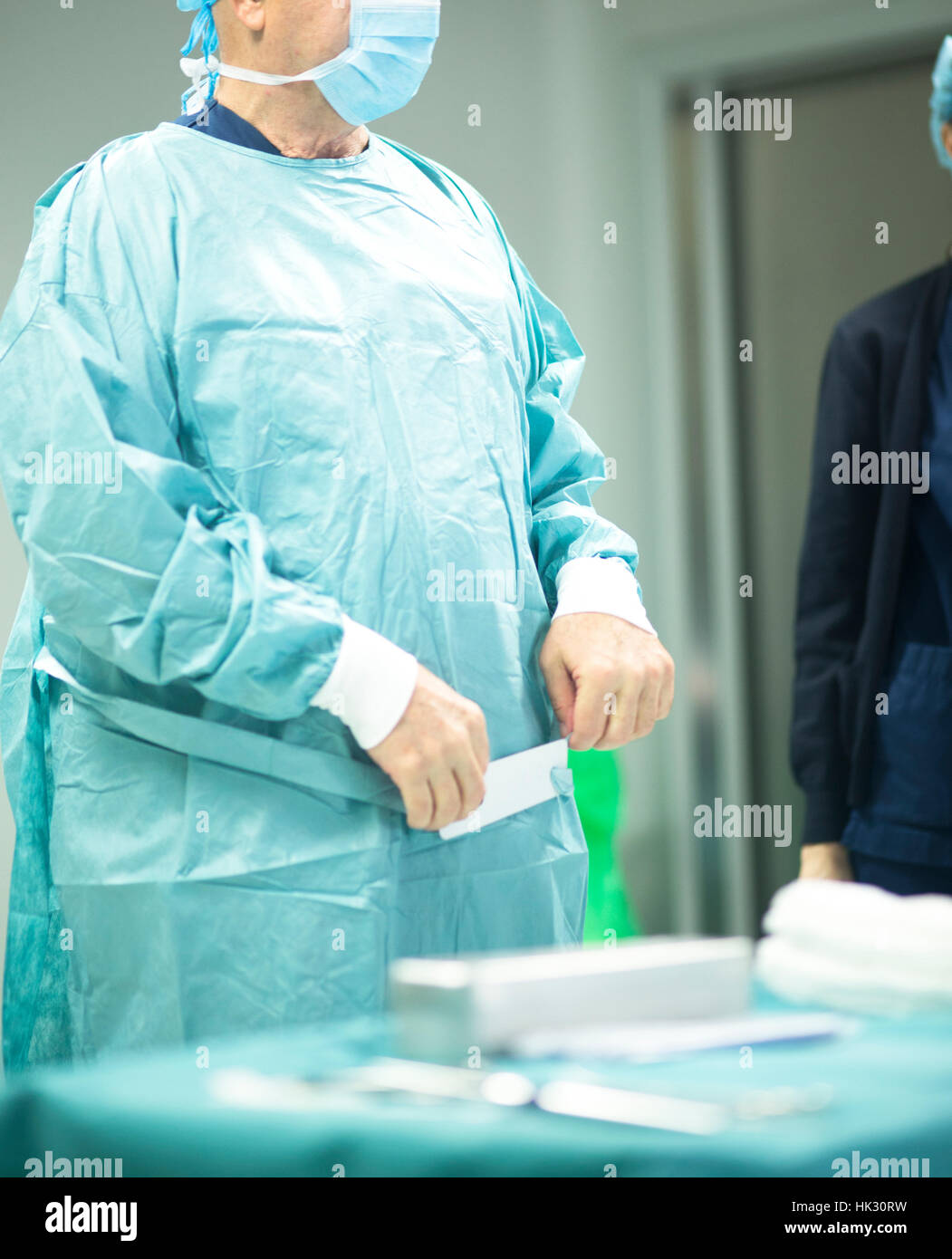 Surgeon in hospital surgery in sterile uniform "scrubs" in operating ...