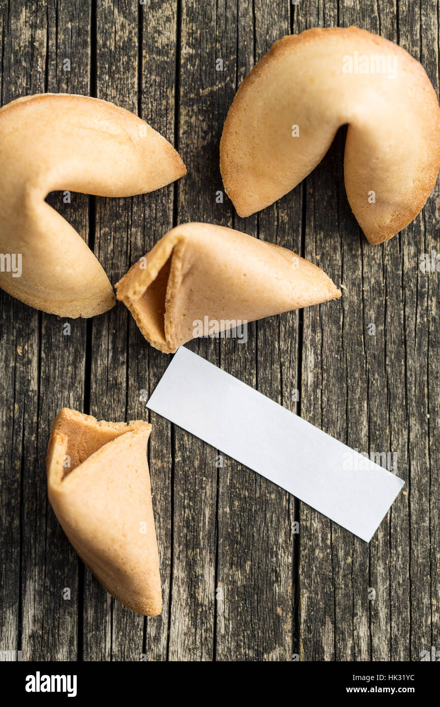 The fortune cookies on old wooden table. Top view Stock Photo - Alamy