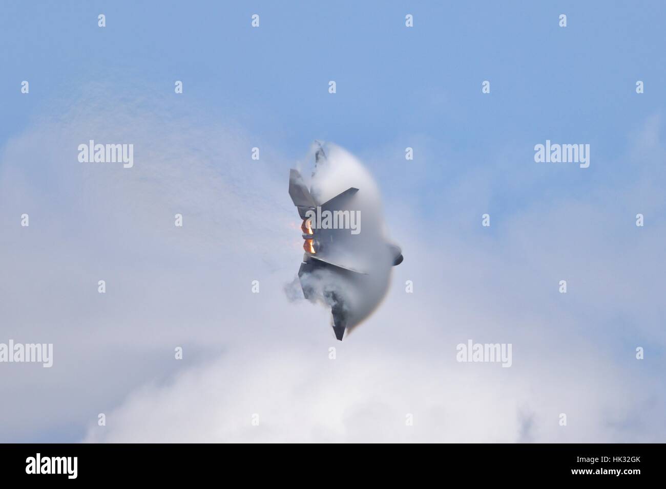 F-22 Raptor fighter jet creating lots of water vapor on its wings at ...