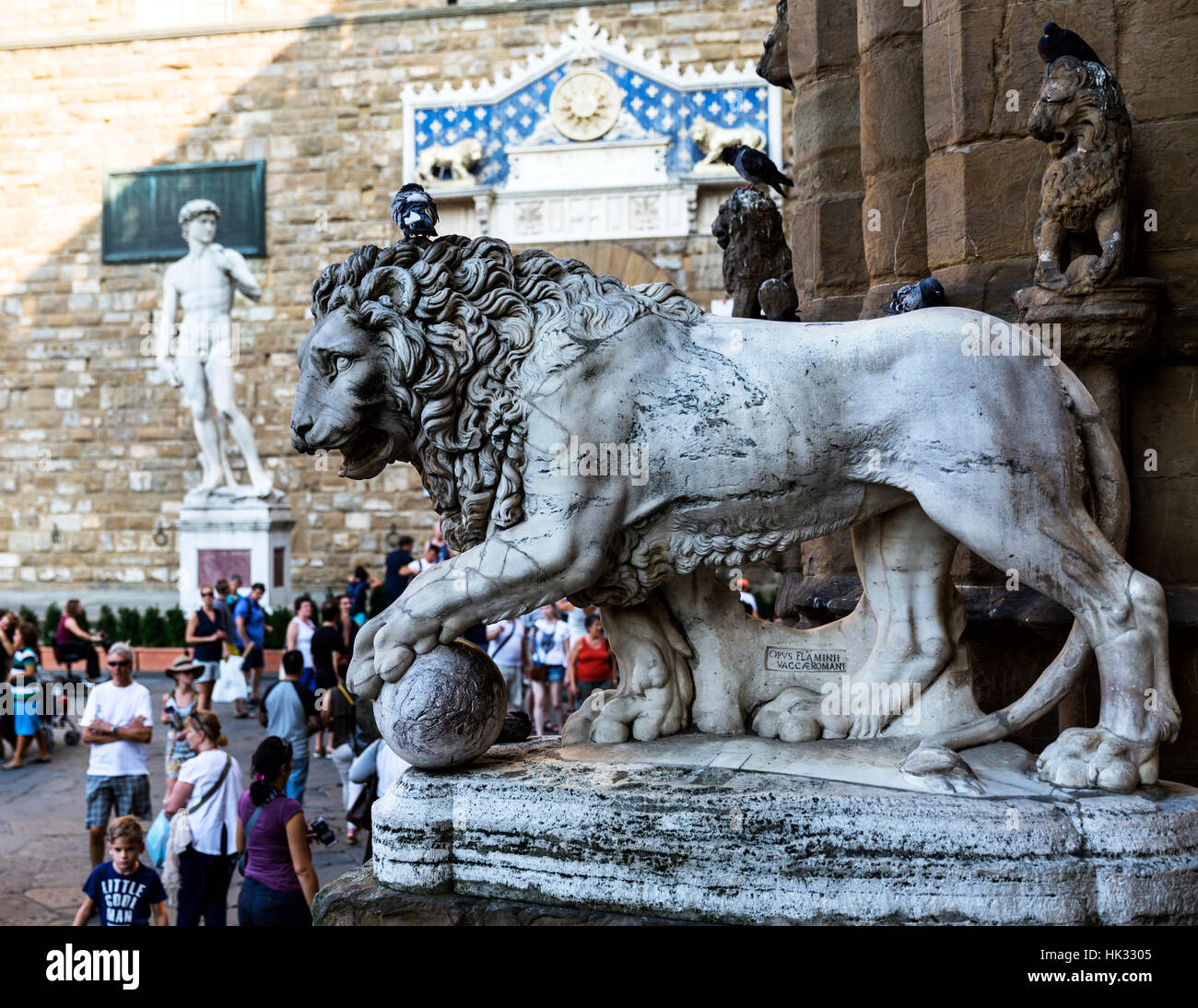One of the Medici lions with a copy of Michelangelo's Statue of David ...