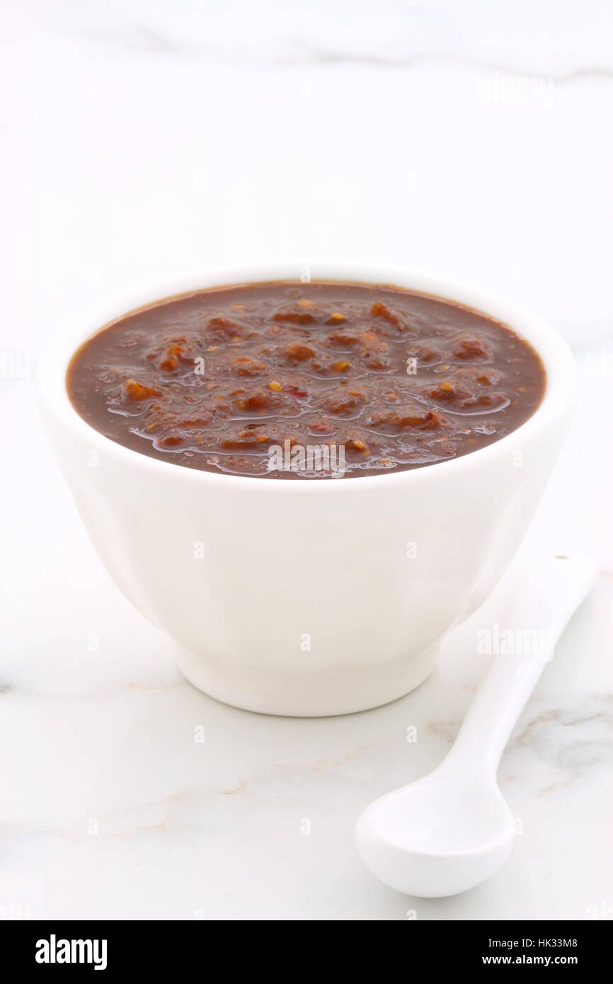 Artisan mexican chipotle sauce on vintage carrara marble table, with a ...