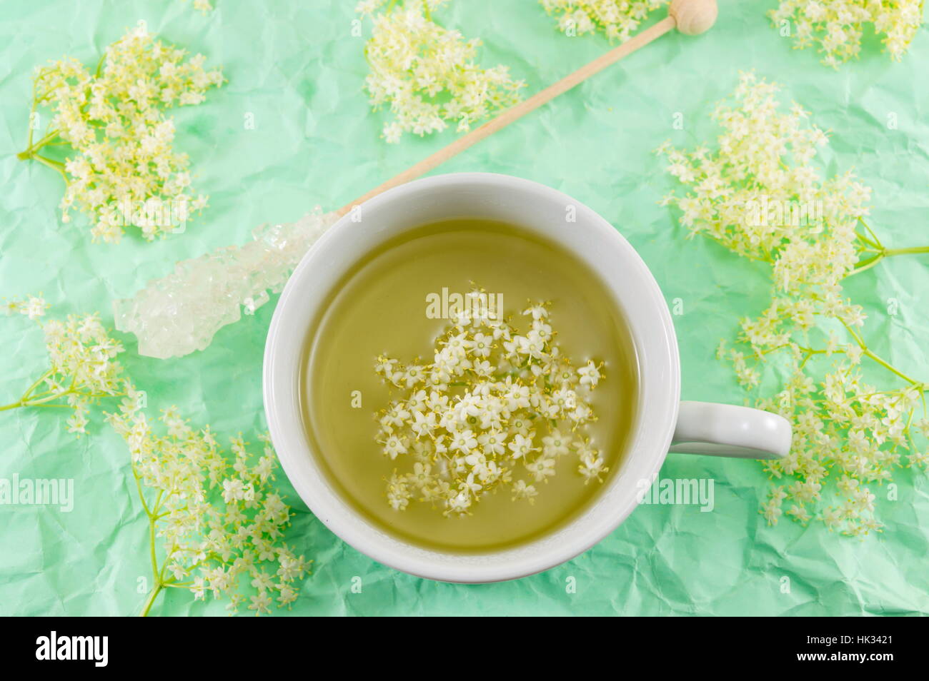 Elderflower tea in a white cup and elder flowers Stock Photo - Alamy