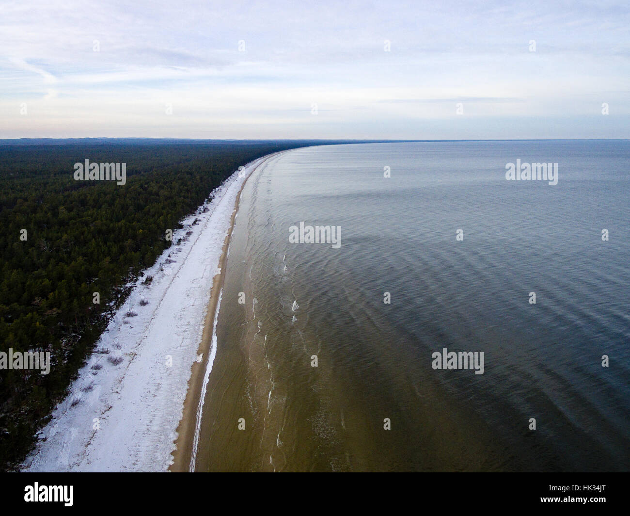 aerial view of frozen beach in winter. drone photography. sea with ...