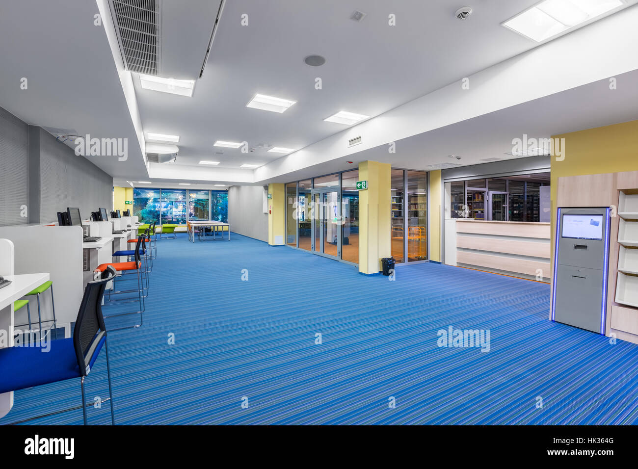 Modern computer room in university library with special device for ...